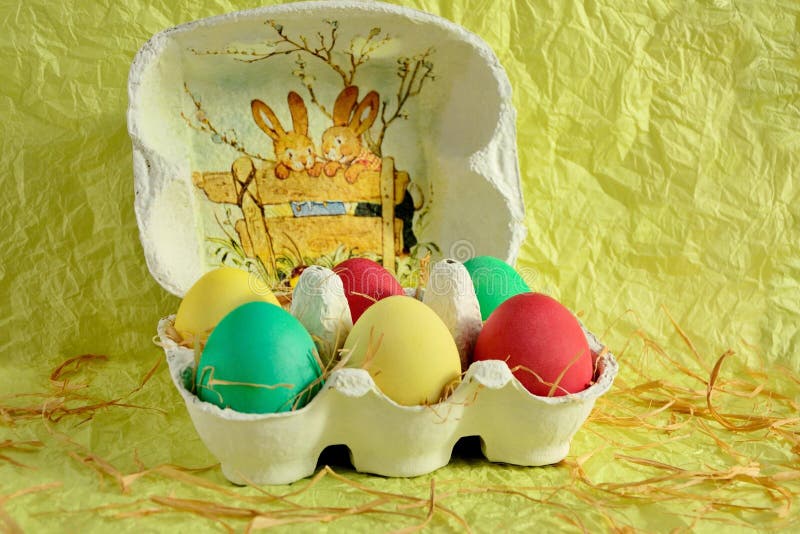 Colorful Easter Eggs in an Egg Box Decorated with an Easter Picture ...