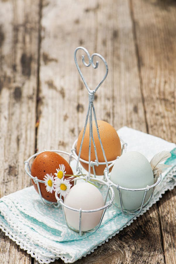 Colorful Easter Eggs in a Small Metal Egg Basket Stock Photo - Image of ...