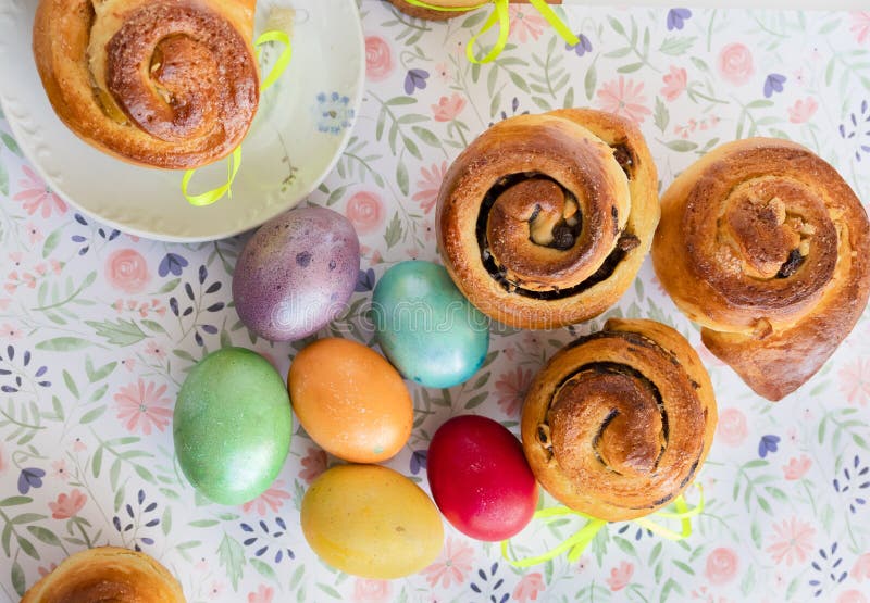 Colorful Easter Eggs and Sweet Buns on a Patterned Surface. Stock Photo ...