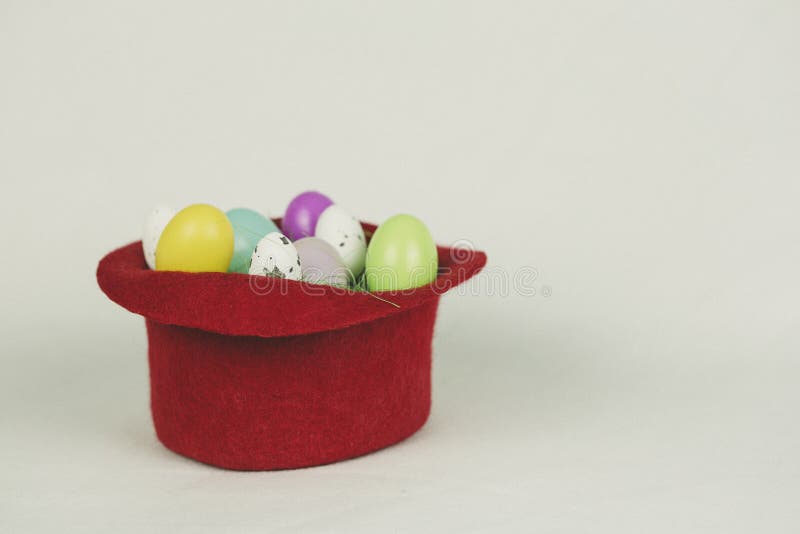 Colorful Eggs Folded into a Red Top Hat Stock Image - Image of easter ...
