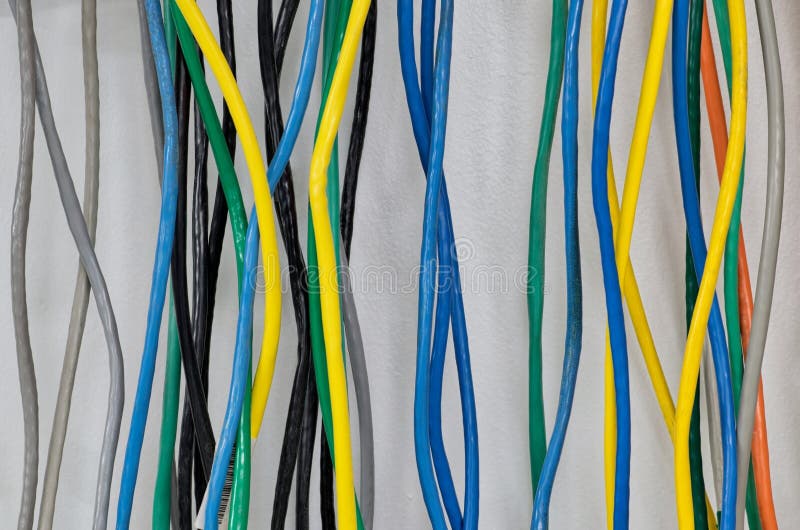 Colorful Electrical Cables Hanging on a Wall Vertically. Stock Photo ...