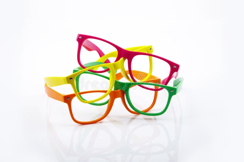 Colorful Eyeglasses Resting on White Reflective Surface Stock Photo ...