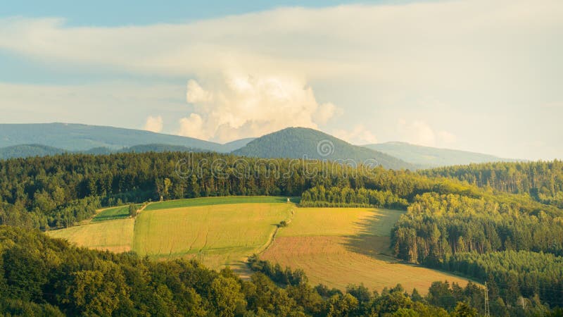 Colorful Farmland in the Mountains between Forests Stock Photo - Image ...