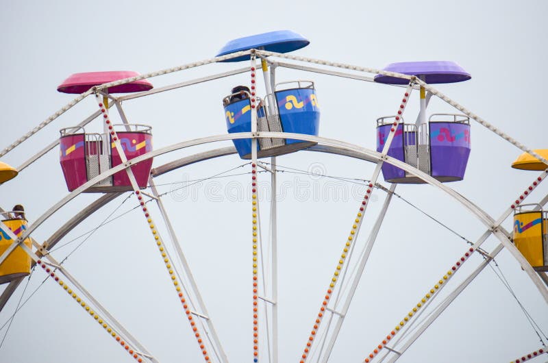 Colorful Ferris Wheel Buckets on an Overcast Day Stock Image - Image of ...