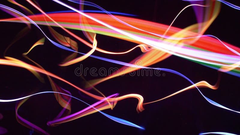 Colorful Fiber Strings in Motion Against Black Background Stock Photo ...