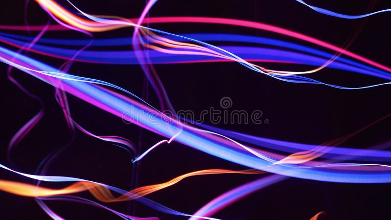 Colorful Fiber Strings in Motion Against Black Background Stock ...