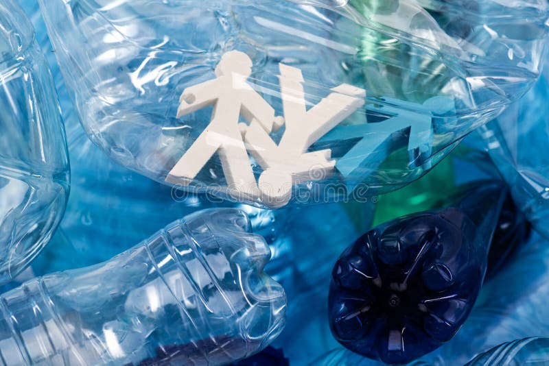 Colorful Figures of People Placed Inside of Plastic Bottle Stock Image ...