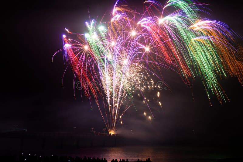 Colorful Firework Popping and Lighting Up the Dark Sky Stock Image ...