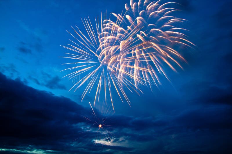 Colorful Fireworks on the Blue Cloudy Sky Stock Photo - Image of party ...