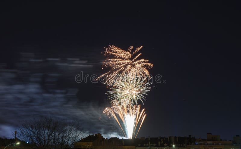 Colorful Fireworks Explode in the Night Sky Over the Skyline of a City ...