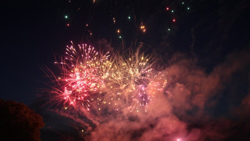 Fireworks Exploding Over the Ocean at Night Stock Photo - Image of ...