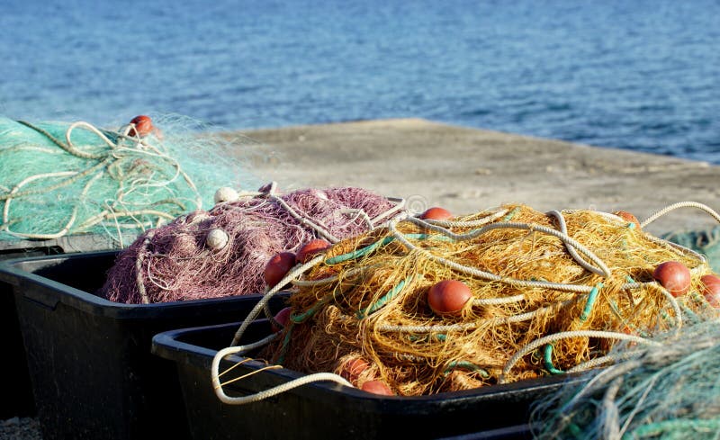 Colorful Fishing Nets in Boxes Prepared on a Dock by the Sea Stock ...