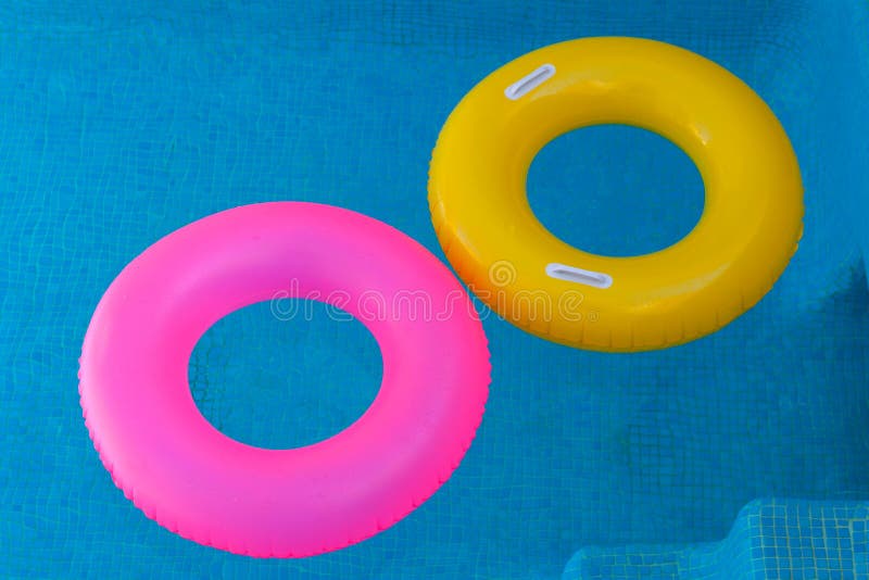 Colorful Floats on a Pool with Crystal Clear Water Stock Photo - Image ...