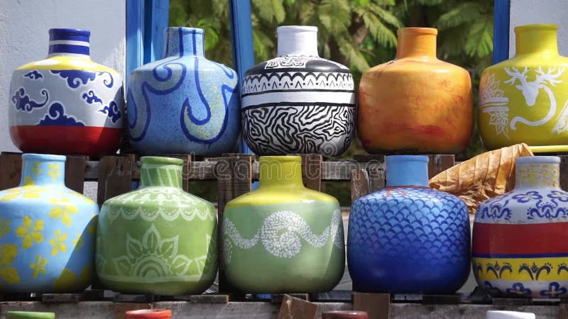 Colorful Flower Pot in the Garden. Flower Pot with Motif Stock Footage ...