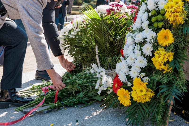 Colorful Flower Wreath Laying Ceremony Honoring Memory and Respect ...