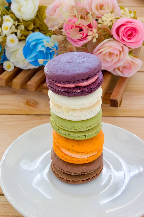 Colorful French Macarons on Wood Panel Stock Photo - Image of flower ...