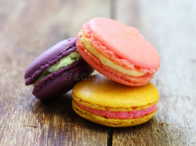 Colorful French Macaroons Stacked on Wood Stock Photo - Image of food ...