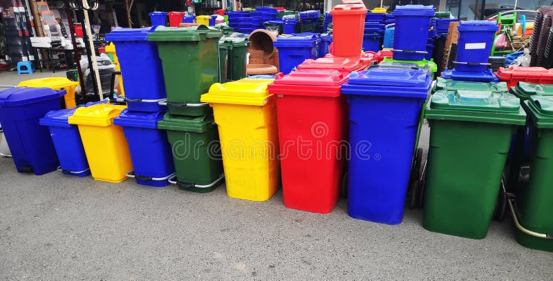 Colorful Garbage Cans are in the Yard for Sale. Stock Photo - Image of ...