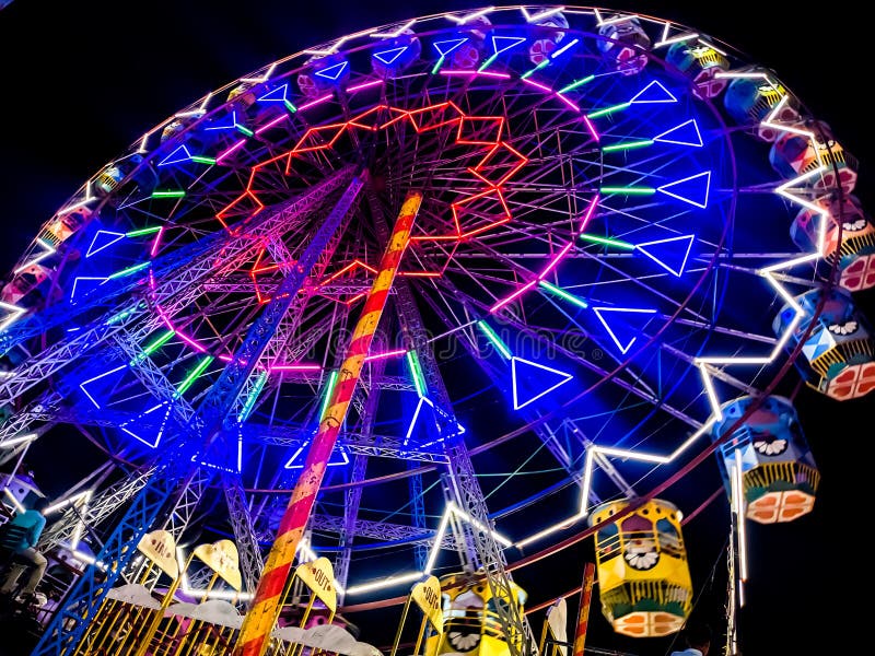 A Colorful Giant Spinning Wheel in the Darkness Stock Image - Image of ...