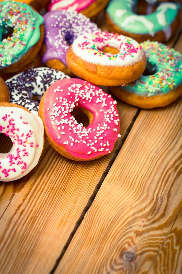 Colorful glazed donuts stock photo. Image of rack, eating - 46112398