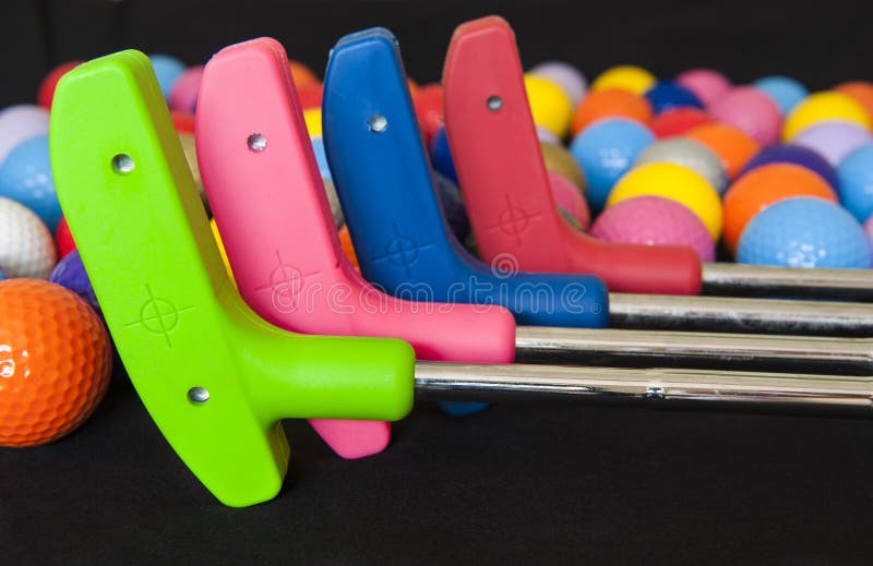 Colorful Golf Balls and Putters Stock Image - Image of game, horizontal ...