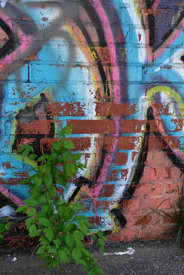 Graffiti on Side of Brick Building Stock Image - Image of outside ...