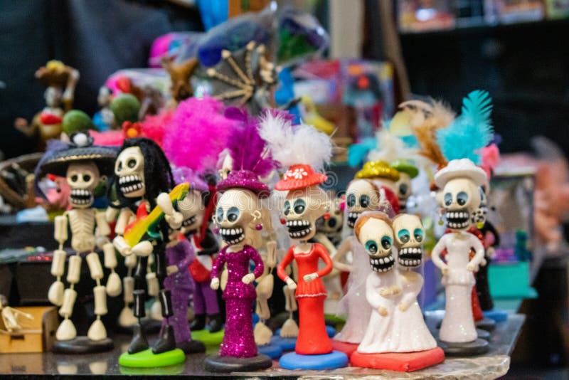 Colorful Handmade Skeleton Figures Displayed on Black Surface Stock ...