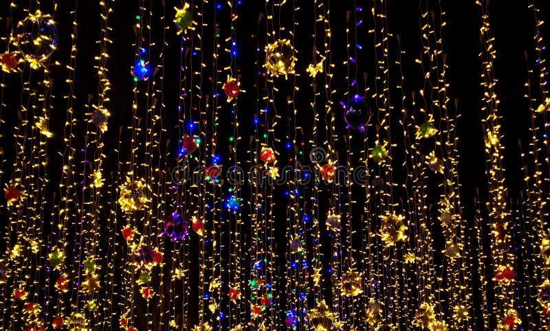 Colorful Holidays Decorations, Garlands in Night Sky Stock Photo ...