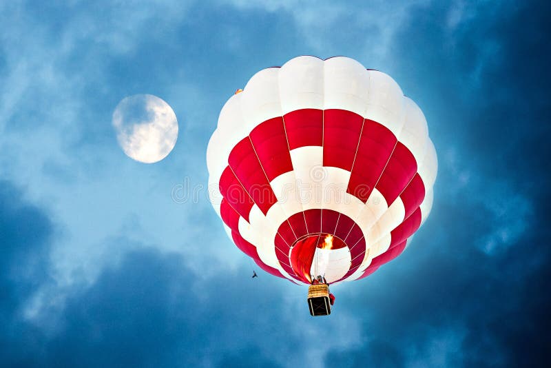 Hot Air Balloon Flight Under the Sunset Sky Stock Photo - Image of ...
