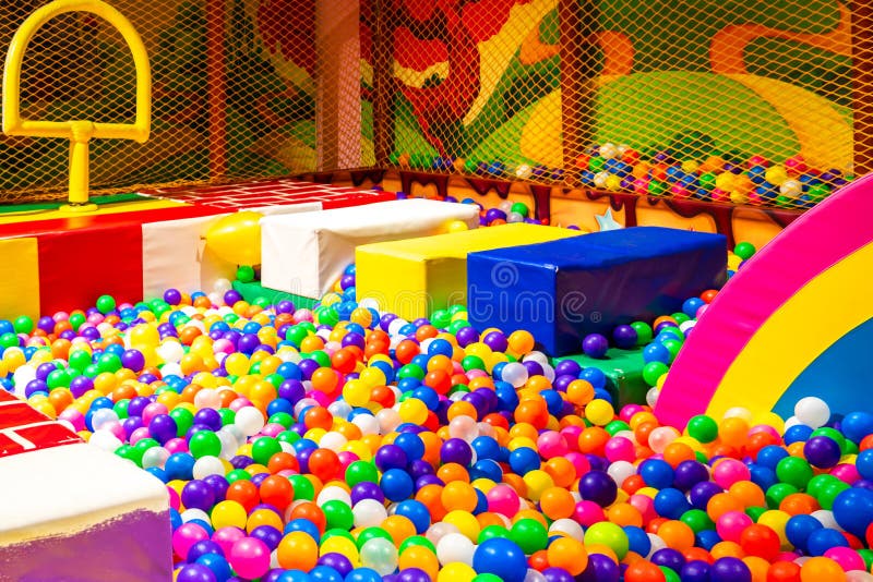 Colorful Indoor Ball Pit with Soft Obstacles and a Rainbow Slide for ...