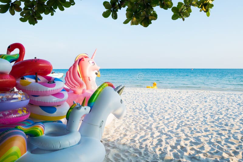 Colorful Inflatable Floating on the Beach Stock Photo - Image of ...