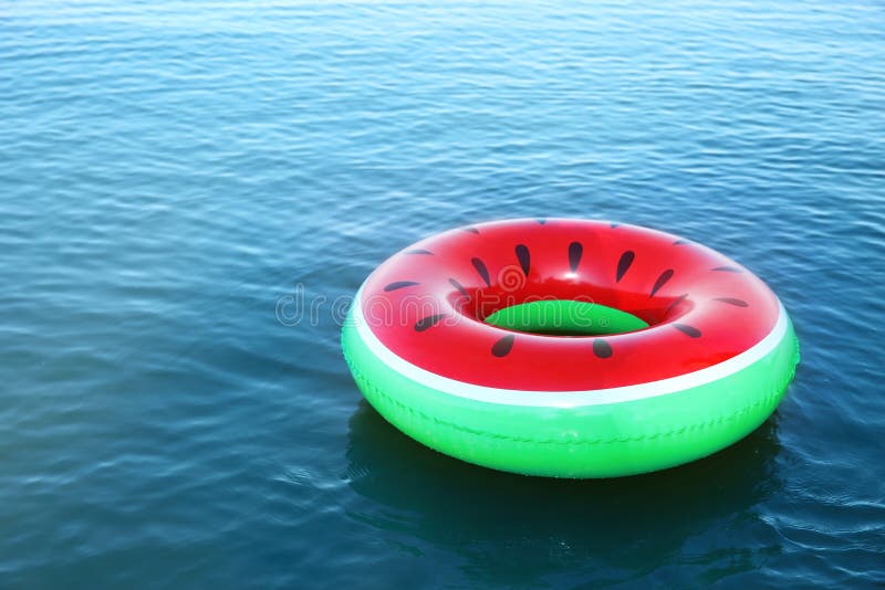 Colorful Inflatable Ring Floating on Sea Water Stock Image - Image of ...