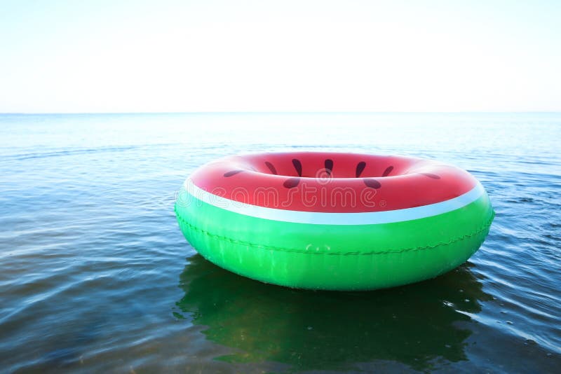 Colorful Inflatable Ring Floating on Sea Water Stock Image - Image of ...