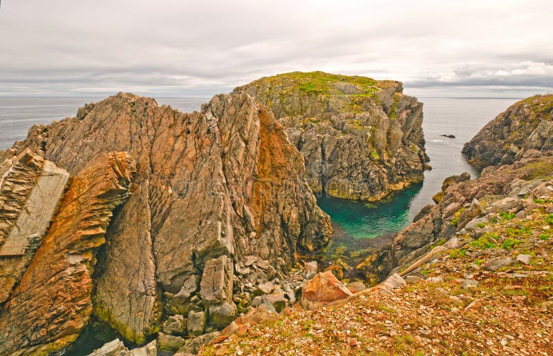 Colorful Jagged Rocks on an Ocean Coast Stock Photo - Image of coast ...