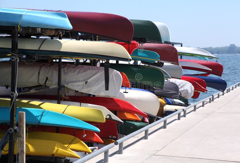 Colorful kayaks for Rent stock image. Image of kayaks - 25621515