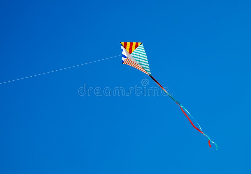 Colorful Kite Flying in Blue Sky Stock Image - Image of flying, leisure ...