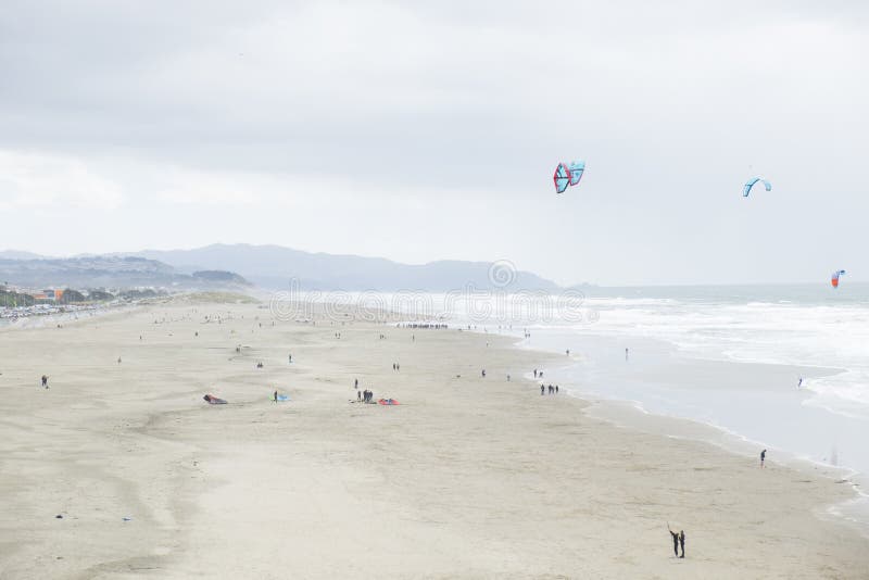 Colorful Kites Flying Over the Beach and the Ocean Stock Photo - Image ...