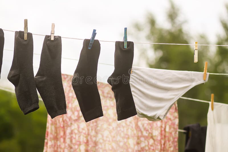 Colorful Laundry Hanging on the Rope Outdoors Stock Photo - Image of ...