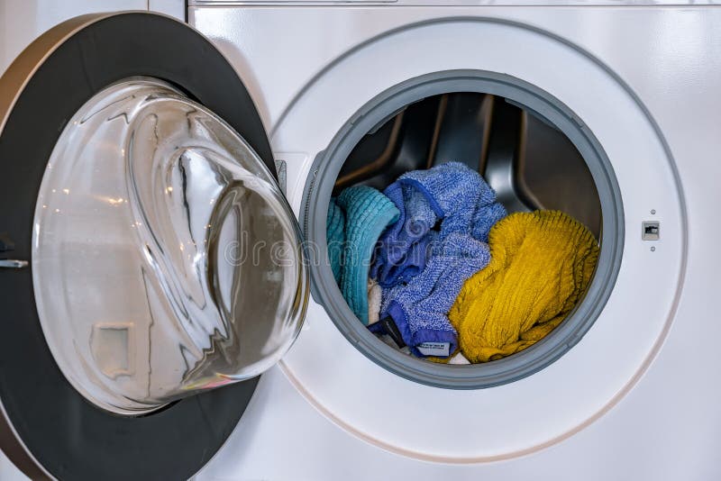 Colorful Laundry Inside a Front Loader Washing Machine Stock Photo ...