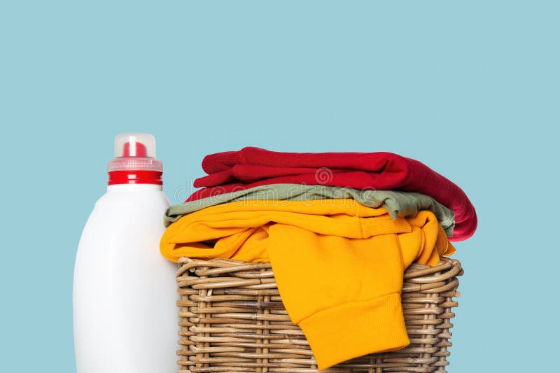 Colorful Laundry Pile with Detergent on Blue Background Stock Image ...