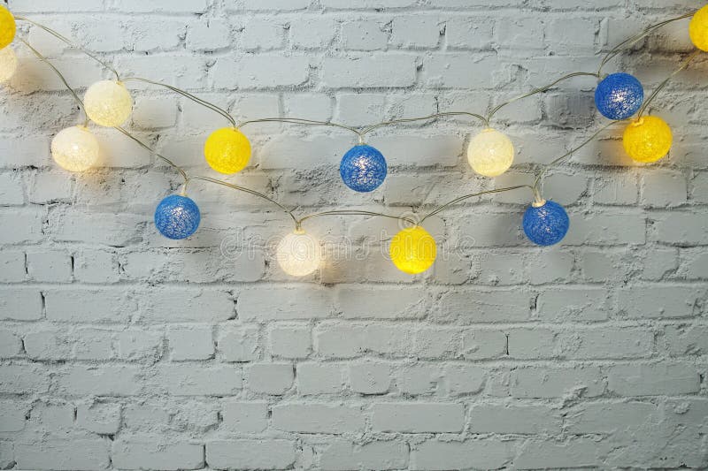 Colorful LED Cotton Ball Decorative Hanging on White Brick Wall ...