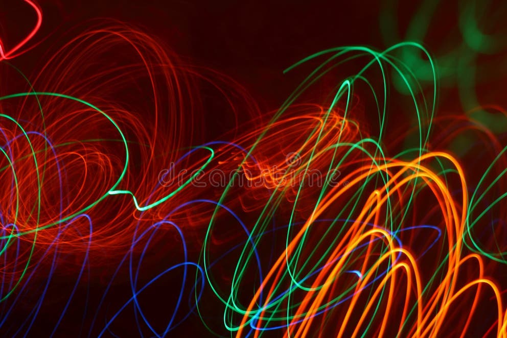 Colorful Light Rays Drawing the Abstract Patterns in the Dark Stock ...