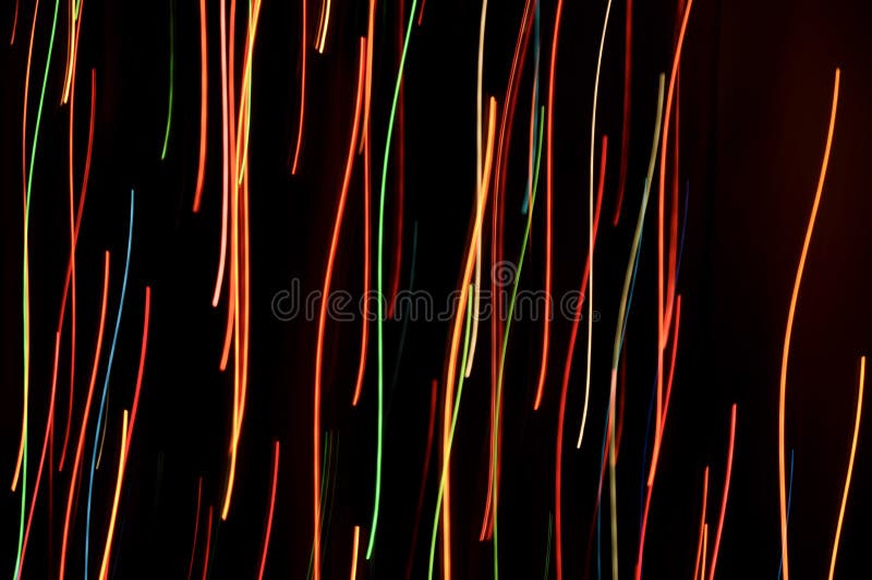Colorful Light Trails in Abstract Patterns Against a Black Background ...