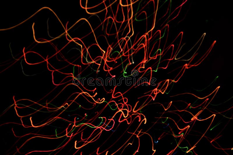 Colorful Light Trails in Abstract Patterns Against a Black Background ...