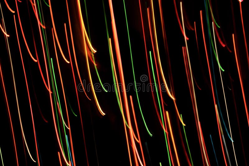 Colorful Light Trails in Abstract Patterns Against a Black Background ...