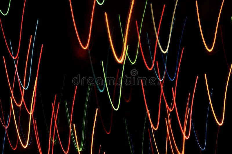 Colorful Light Trails in Abstract Patterns Against a Black Background ...