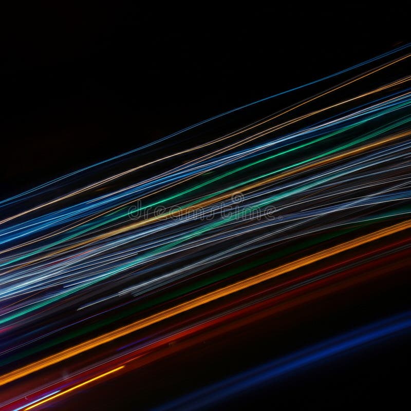 Colorful Light Trails Streak Across a Dark Background, Creating an ...