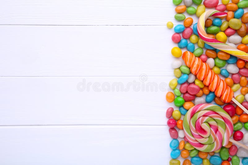 Colorful Lollipops and Different Colored Round Candy on White ...