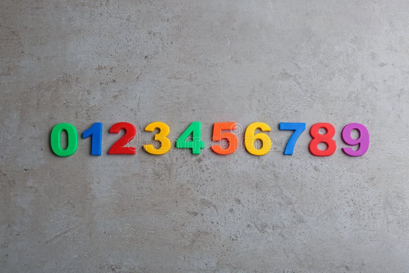 Colorful Magnetic Numbers on Grey Stone Background Stock Image - Image ...