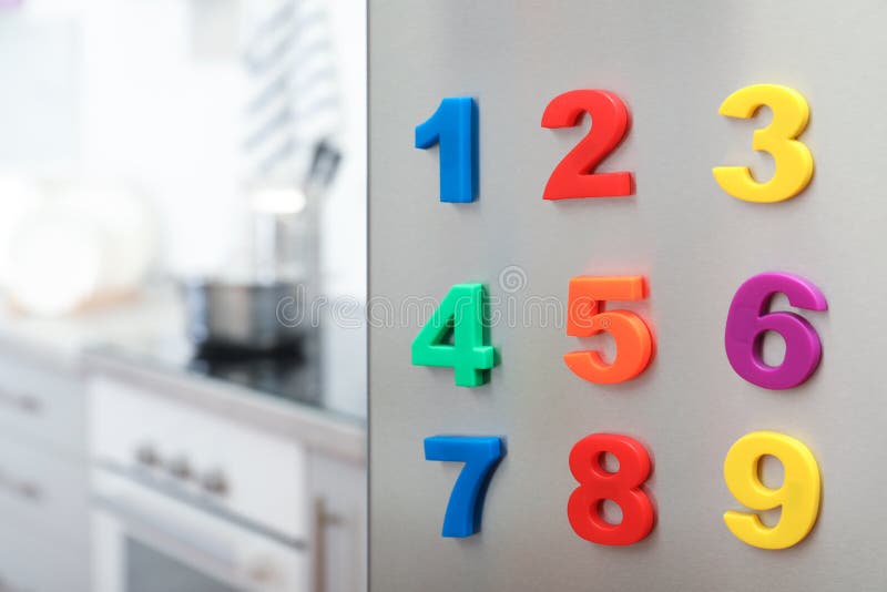 Colorful Magnetic Numbers on Refrigerator Door in Kitchen Stock Photo ...